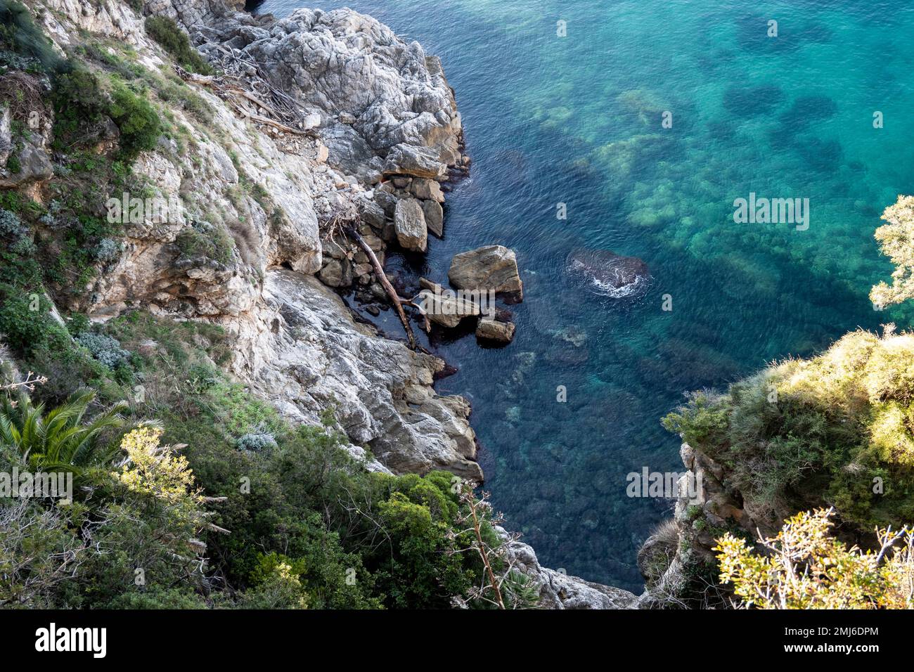 Beautiful, steep, rocky cliffs above Dubrovnik beaches with crystal ...