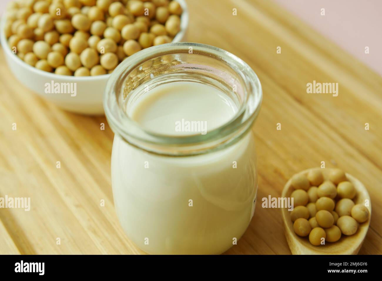 soy milk pouring in a glass jar Stock Photo - Alamy