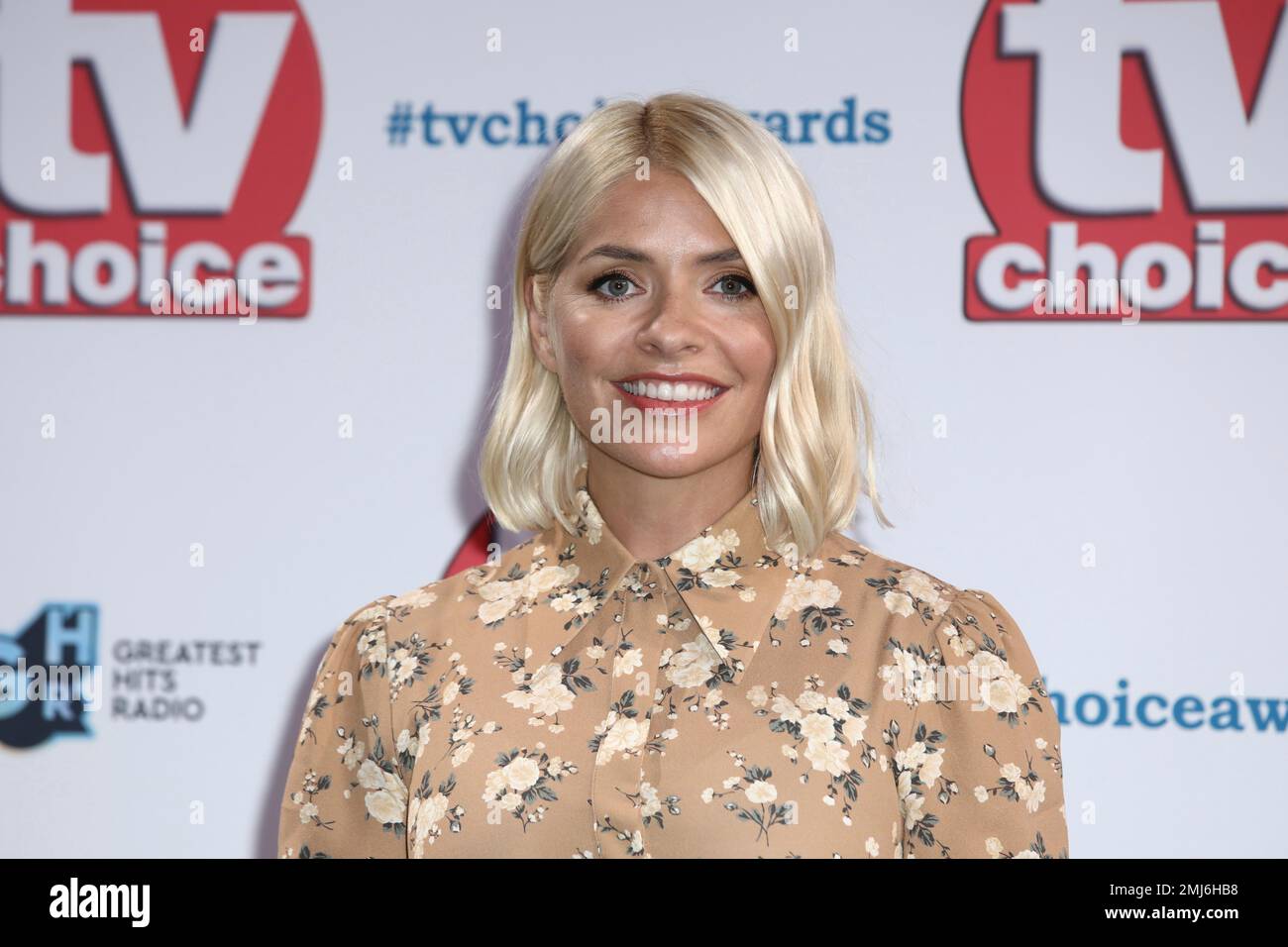 Tv Presenter Holly Willoughby poses for photographers on arrival at the ...