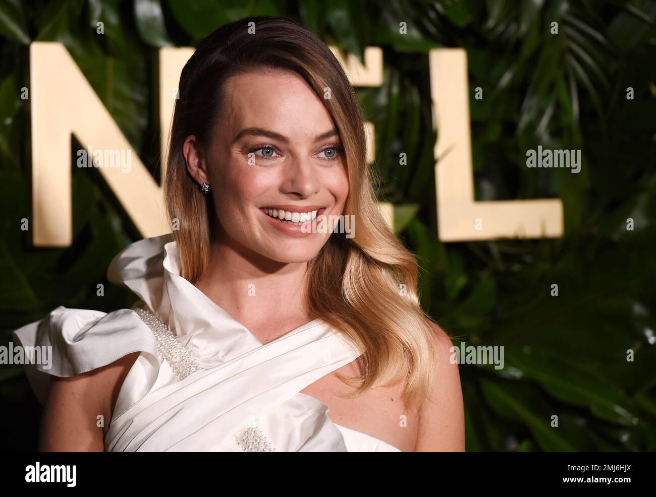 Actress Margot Robbie poses at the launch of the Gabrielle Chanel ...