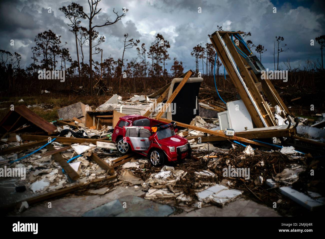 A toy fire engine sits in the rubble of a house destroyed by Hurricane ...