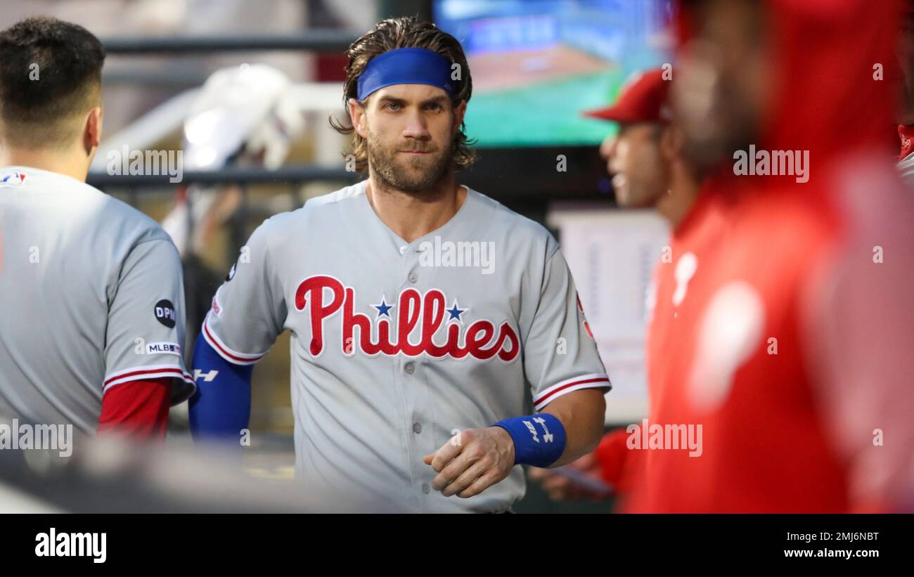Philadelphia Phillies' Bryce Harper arrives in the dugout before the ...