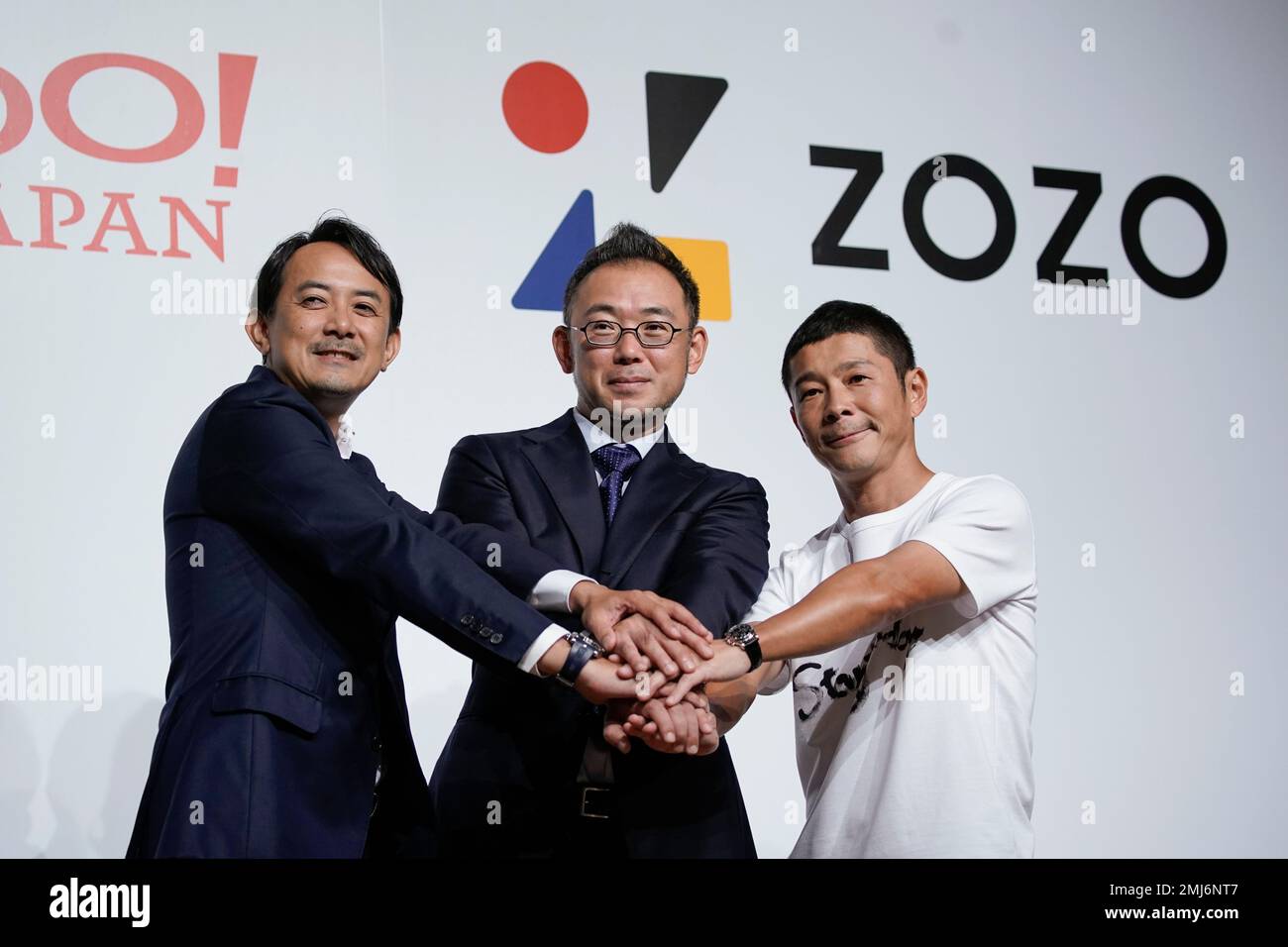 Yahoo Japan's Kentaro Kawabe, from left, Zozo's new CEO, Kotaro Sawada ...