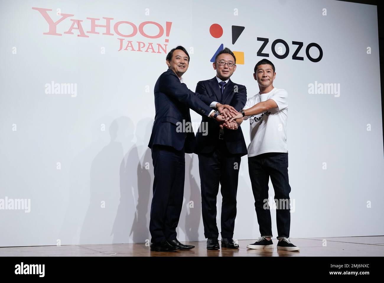 Yahoo Japan's Kentaro Kawabe, from left, Zozo's new CEO, Kotaro Sawada, and Zozo founder, Yusaku ...