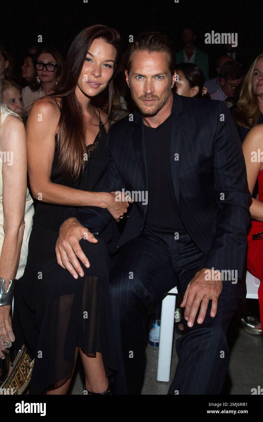 Liz Godwin, left, and Jason Lewis, right, attend the Badgley Mischka ...