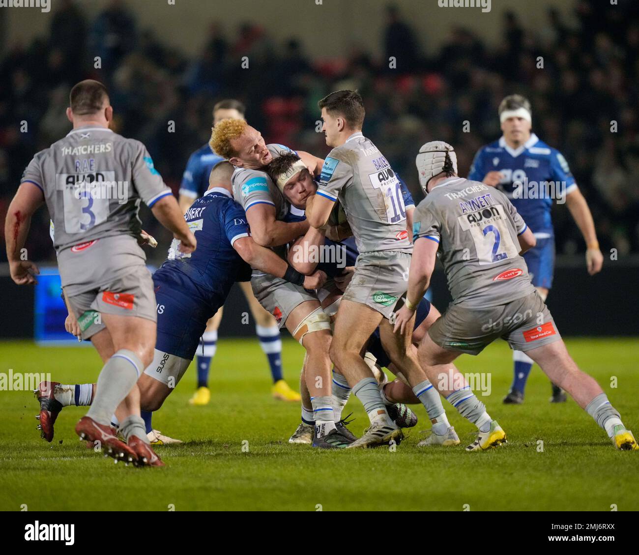 Cobus Wiese #4 of Sale Sharks is held by Miles Reid #8 and Orlando ...