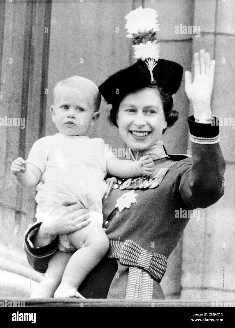 Queen Elizabeth II of England holds her infant son, Prince Edward, on ...