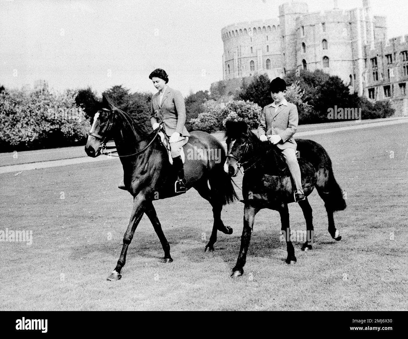 Britain's Queen Elizabeth II and her son Prince Charles ride on the ...