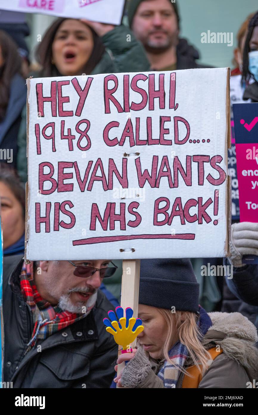 Striking nurses with placards, demonstrating outside University College ...