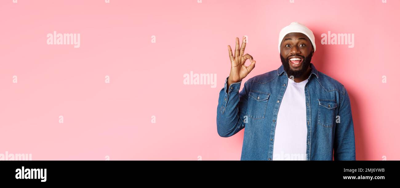Happy smiling Black guy showing okay sign, approve and praise good ...
