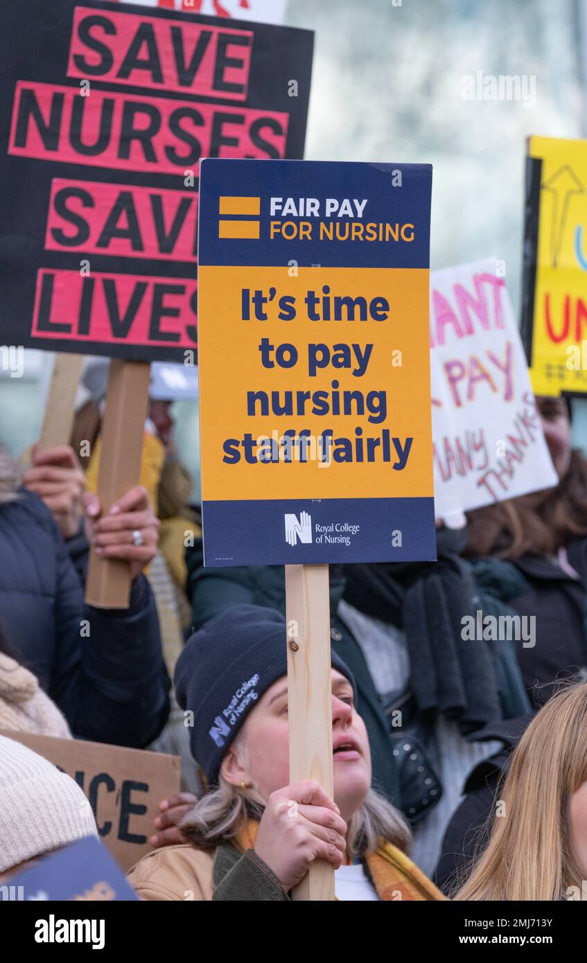 Striking nurses with placards, demonstrating outside University College ...