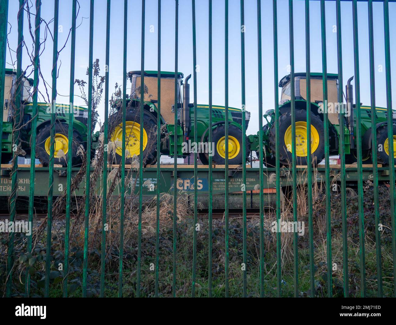 Batumi, Georgia. 01.18.2023 New green tractors behind the fence ...