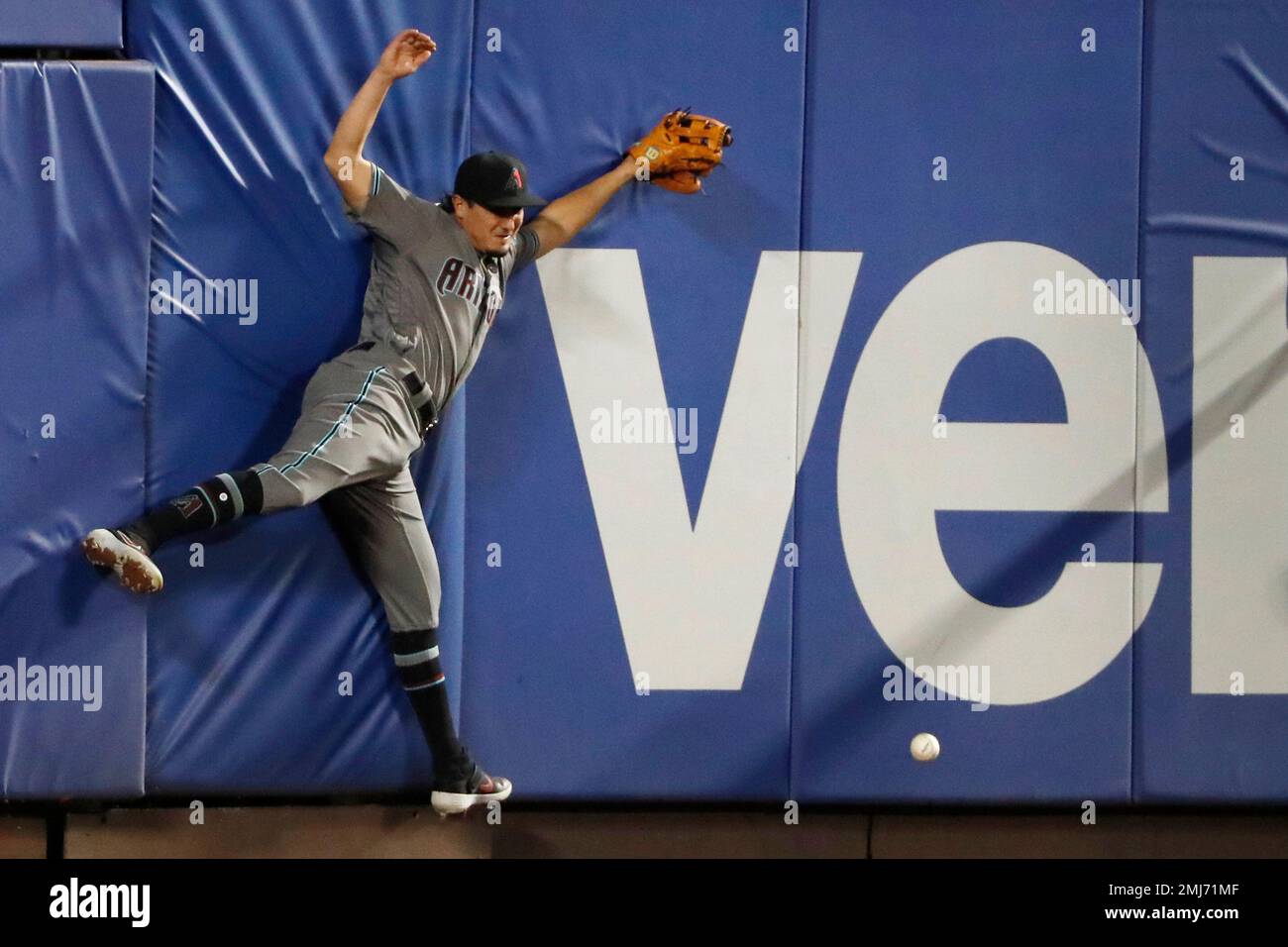 Arizona Diamondbacks left fielder Josh Rojas leaps for but can't reach ...