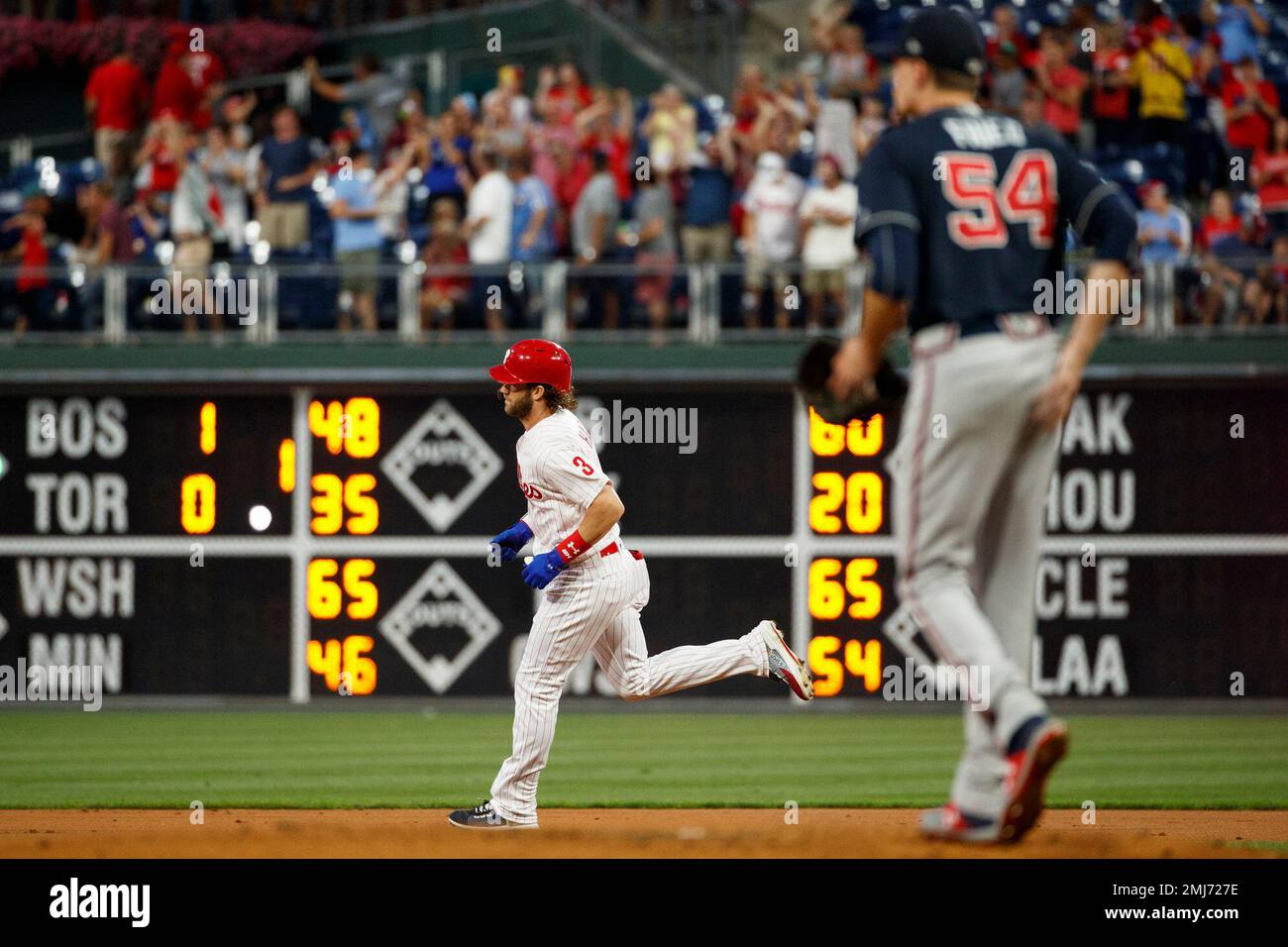 Philadelphia Phillies' Bryce Harper, left, rounds the bases after ...