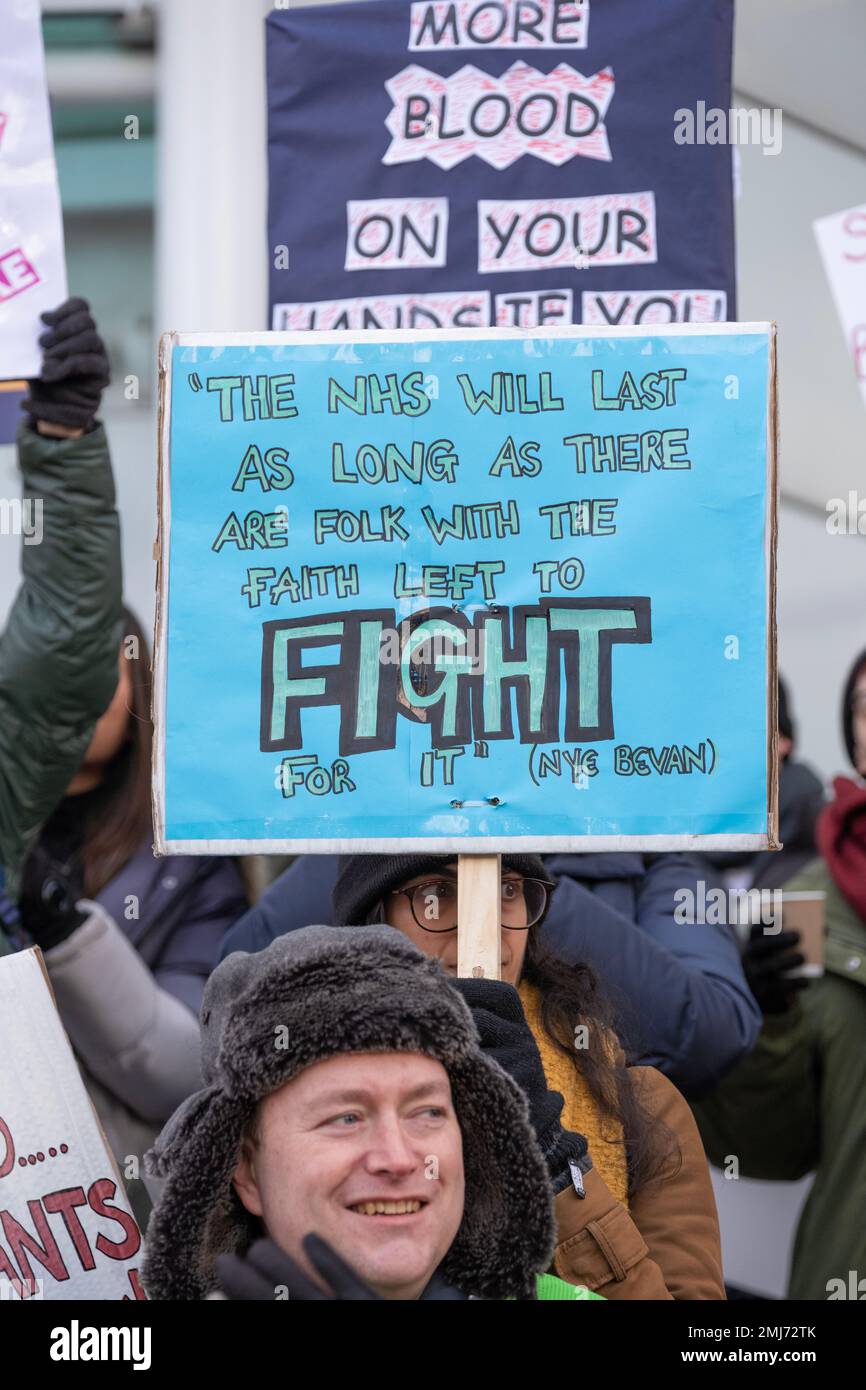 Striking nurses with placards, demonstrating outside University College ...