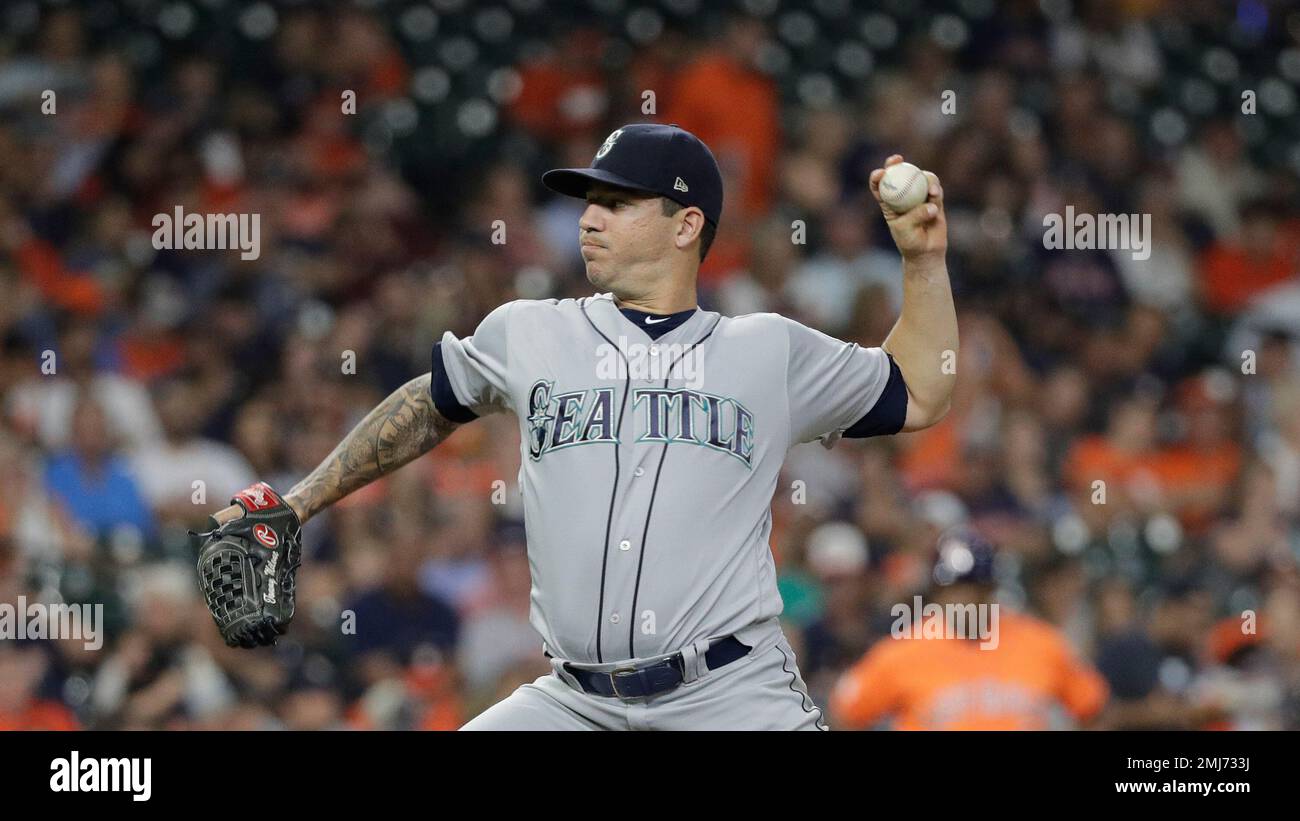 Seattle Mariners pitcher Tommy Milone throws against the Houston Astros ...