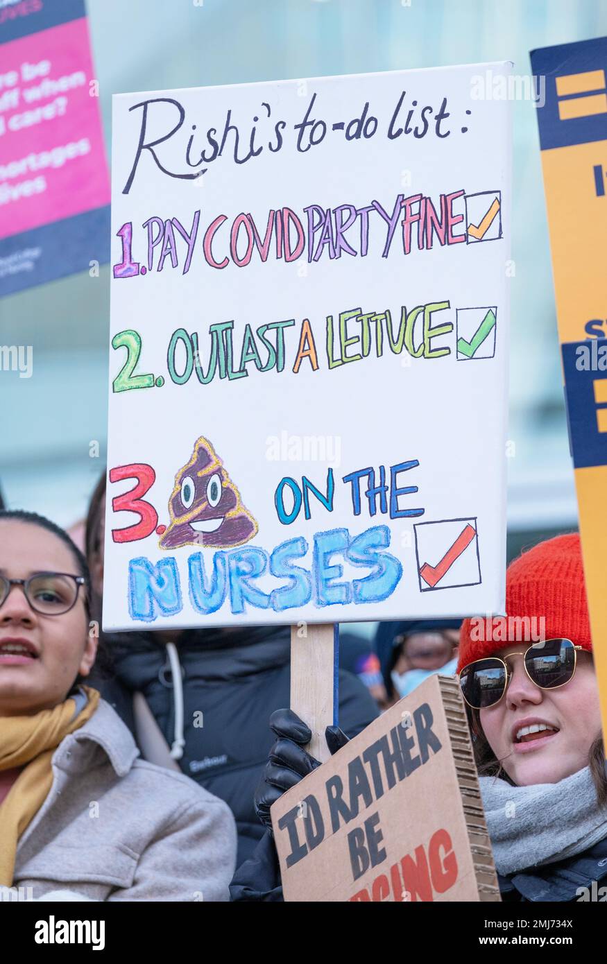 Striking nurses with placards, demonstrating outside University College ...