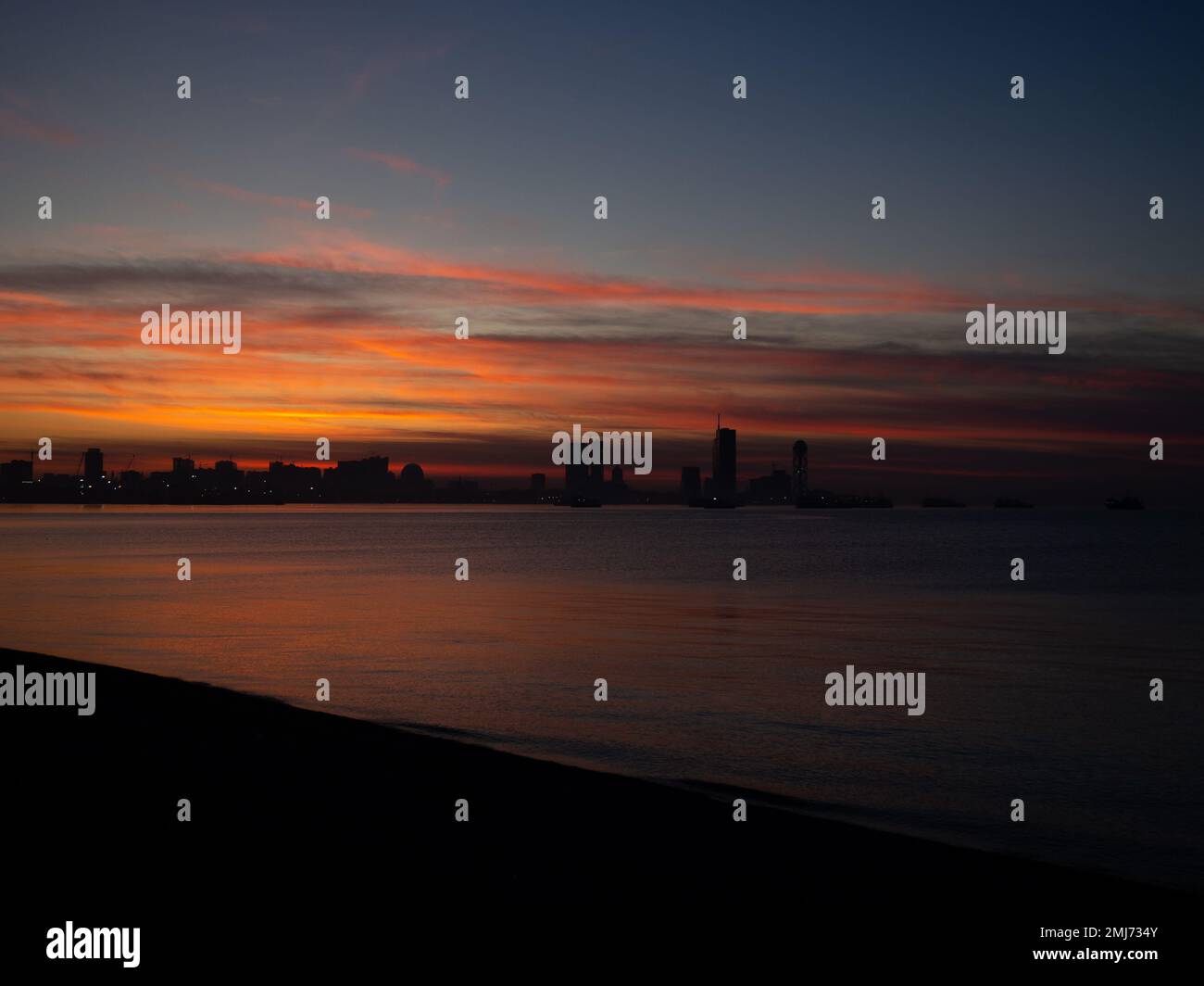 Batumi at sunset. Sights of Georgia in the evening. Red sunset. View of ...