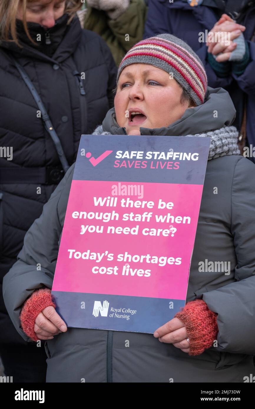 Striking nurses with placards, demonstrating outside University College ...