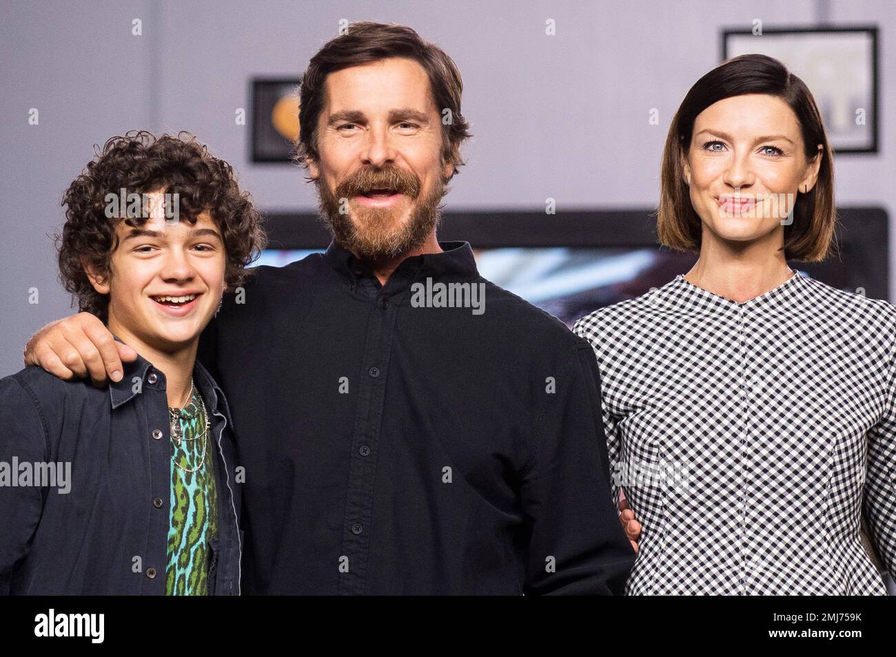From left, actors Noah Jupe, Christian Bale, and Caitriona Balfe attend ...