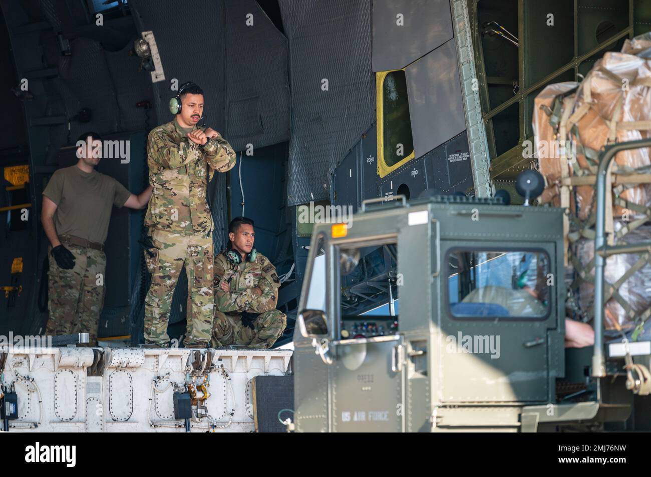 U.S. Air Force Staff Sgt. Kevin Garcia-Andrade, middle, 22nd Airlift ...