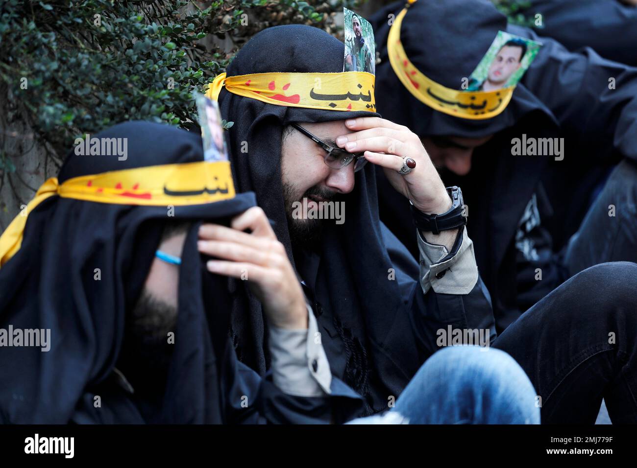 Lebanese Shiite supporters of the Iranian-backed Hezbollah group, with ...