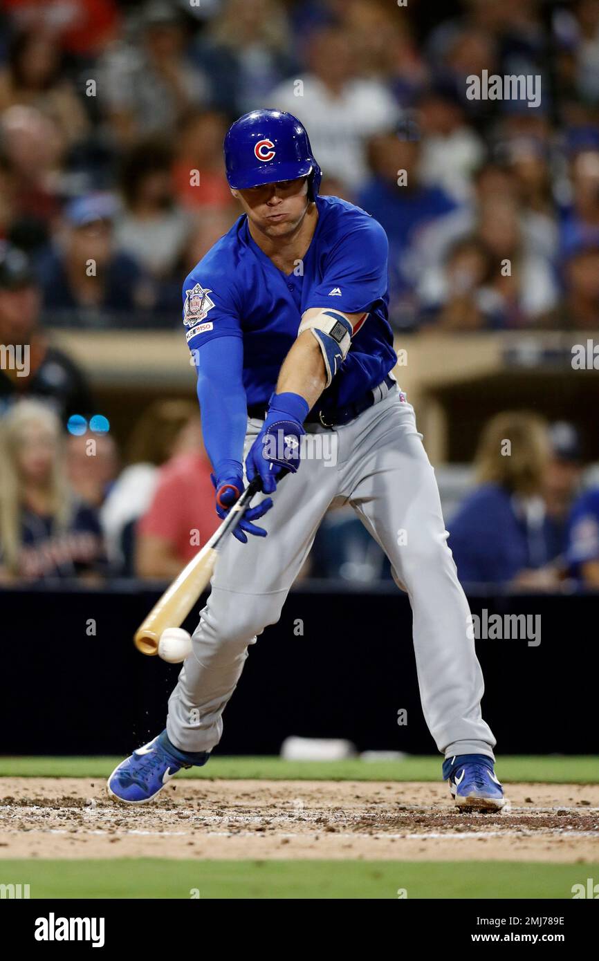 Chicago Cubs' Nico Hoerner hits a single during the fourth inning of a ...