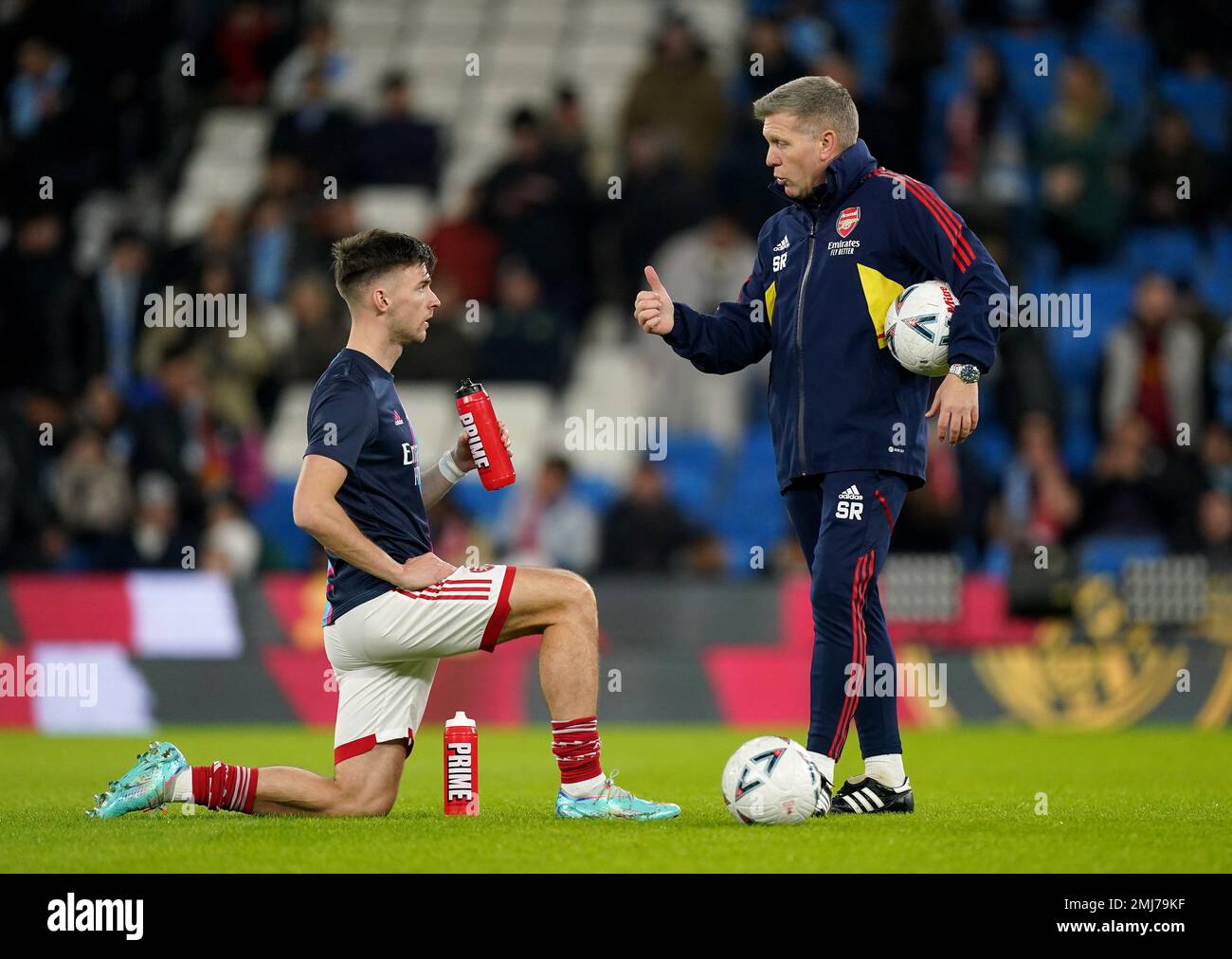 Arsenal assistant manger Steve Round (right) speaks to Kieran Tierney ...