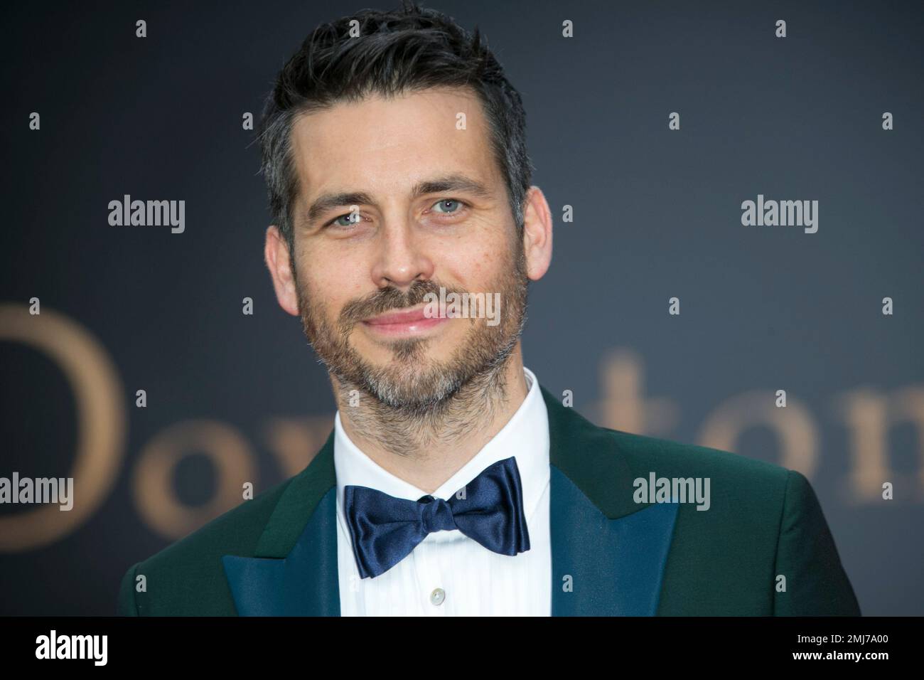 Robert James-Collier poses for photographers upon arrival at the World ...