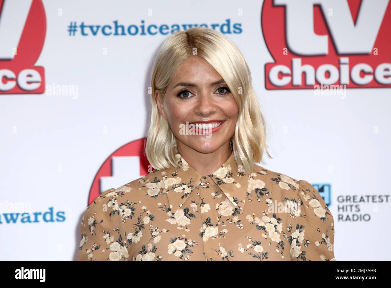 TV Presenter Holly Willoughby poses for photographers on arrival at the ...