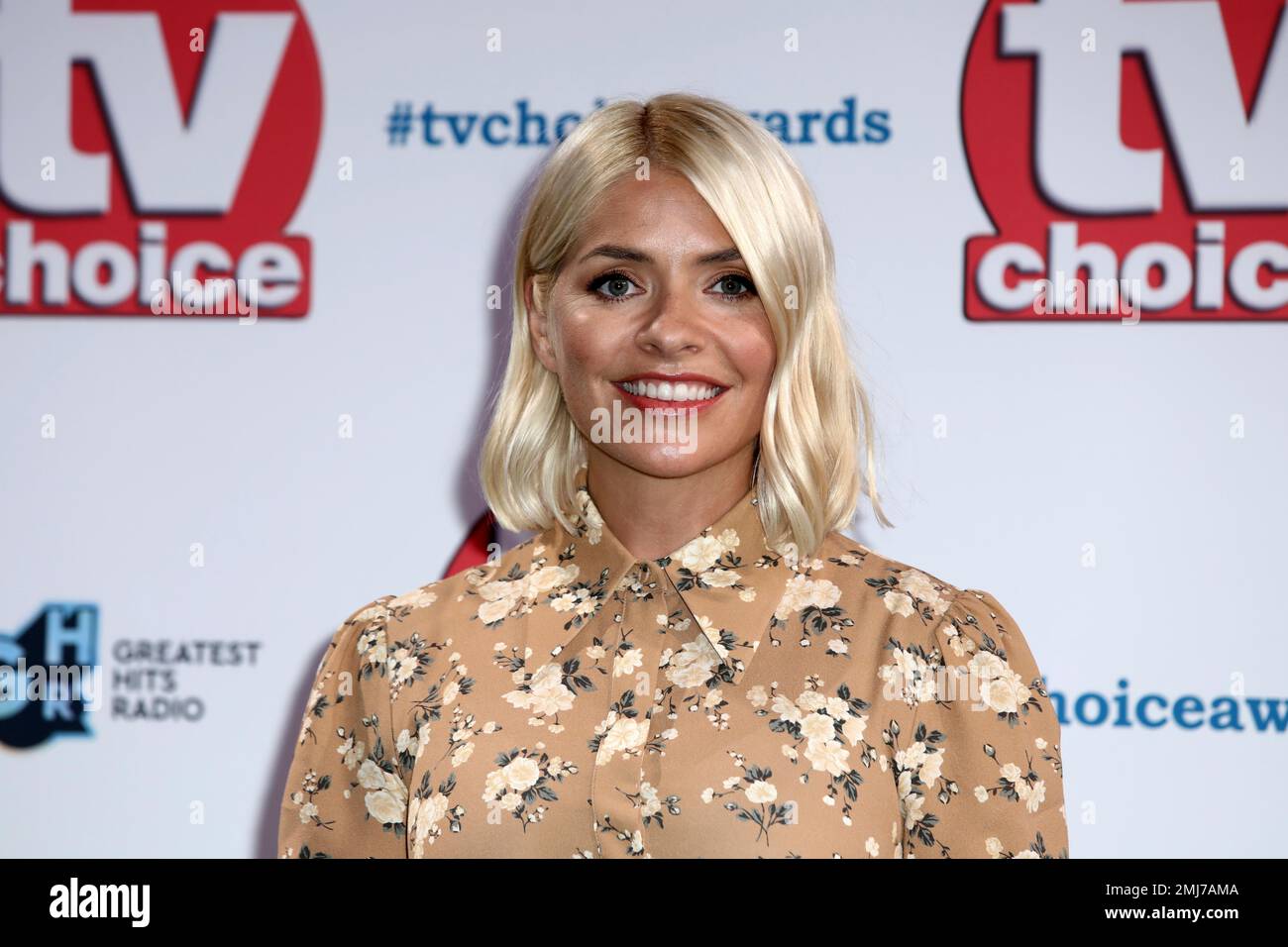 TV Presenter Holly Willoughby poses for photographers on arrival at the ...
