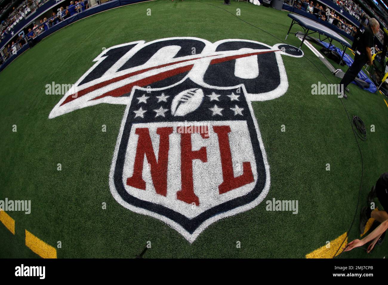 The 100th anniversary logo of the NFL is fashioned into the sideline ...