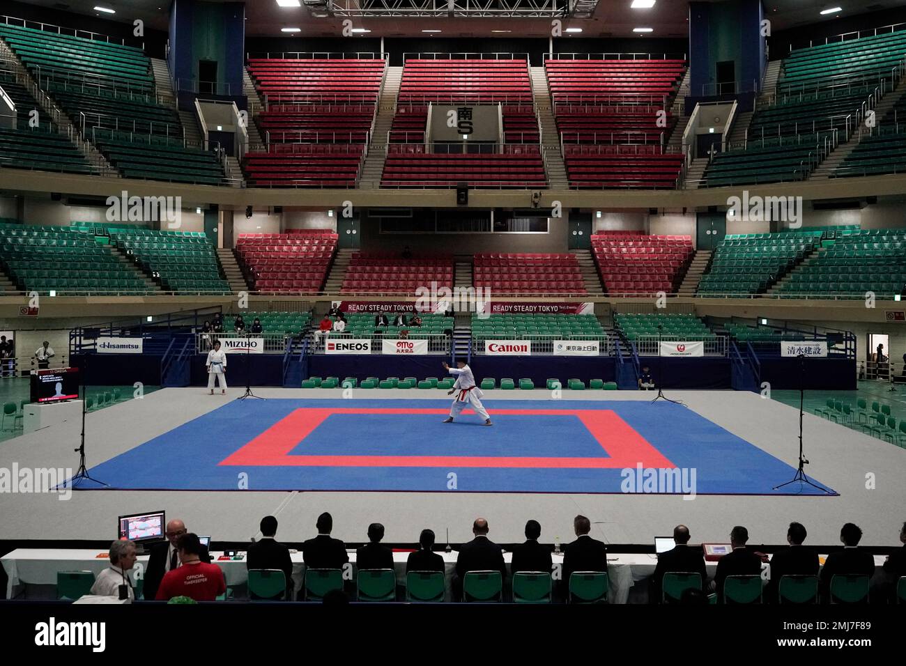 An athlete performs kata moves during a karate test event at Nippon ...