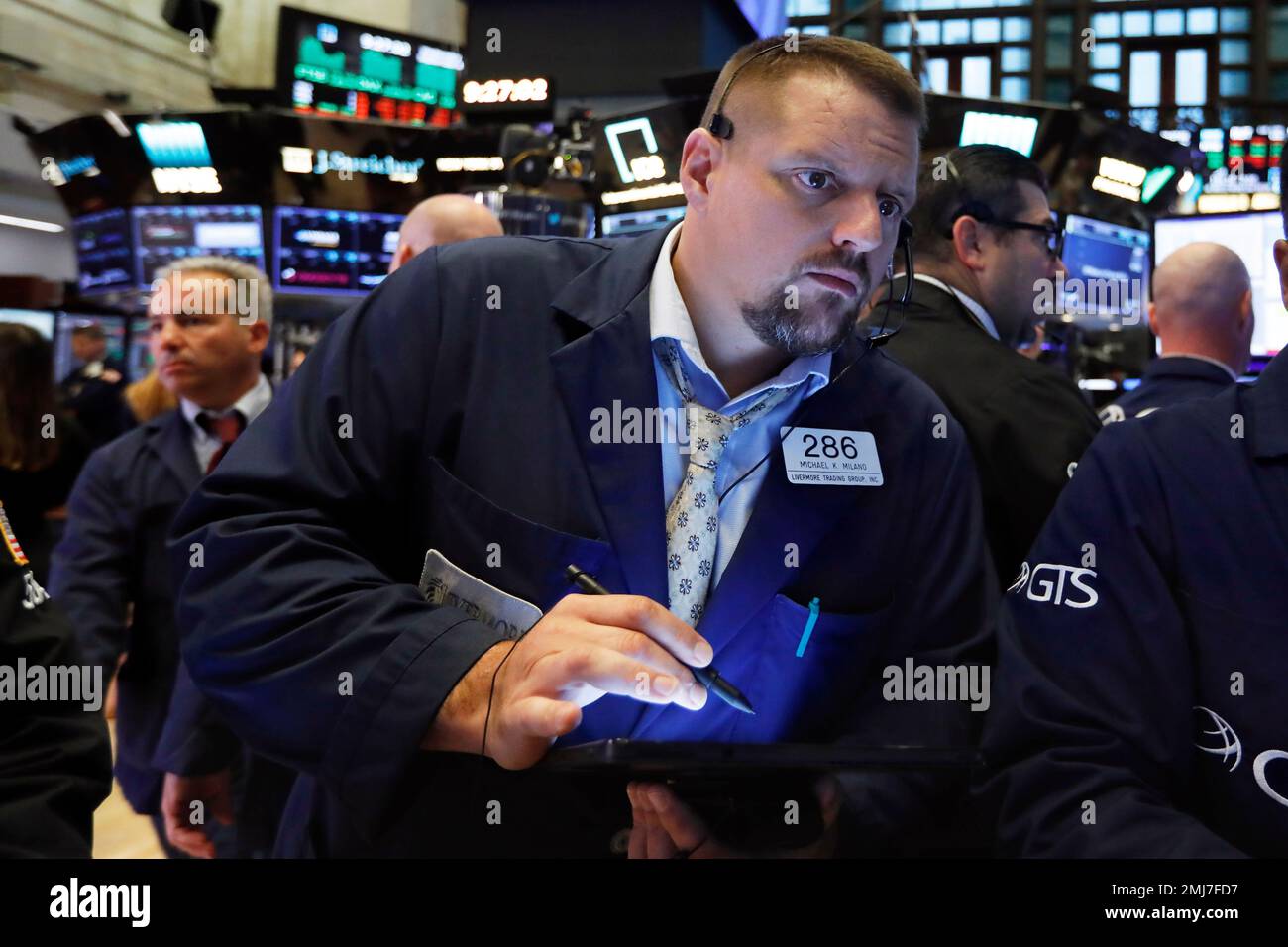 FILE - In this Sept. 4, 2019, file photo trader Michael Milano works on ...
