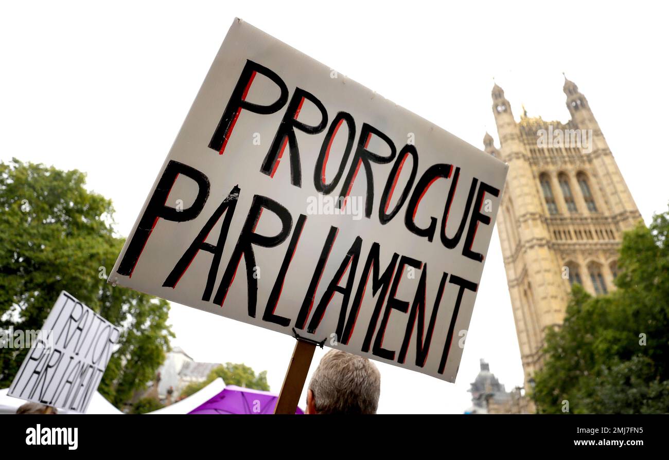 A pro-brexit campaigner holds a banner near Parliament in London ...