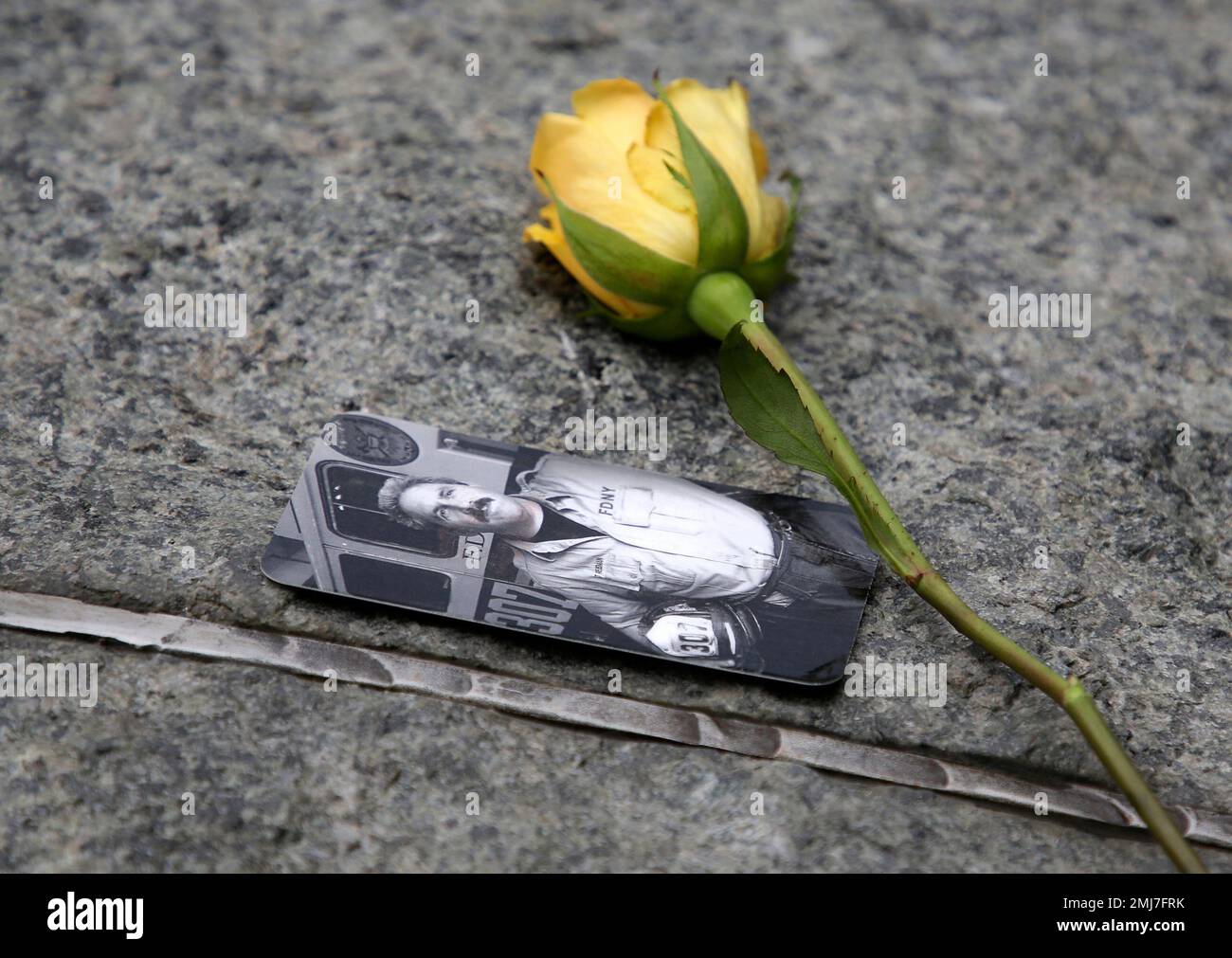 FILE - In this May 30, 2019 file photo, a rose rests next to a ...