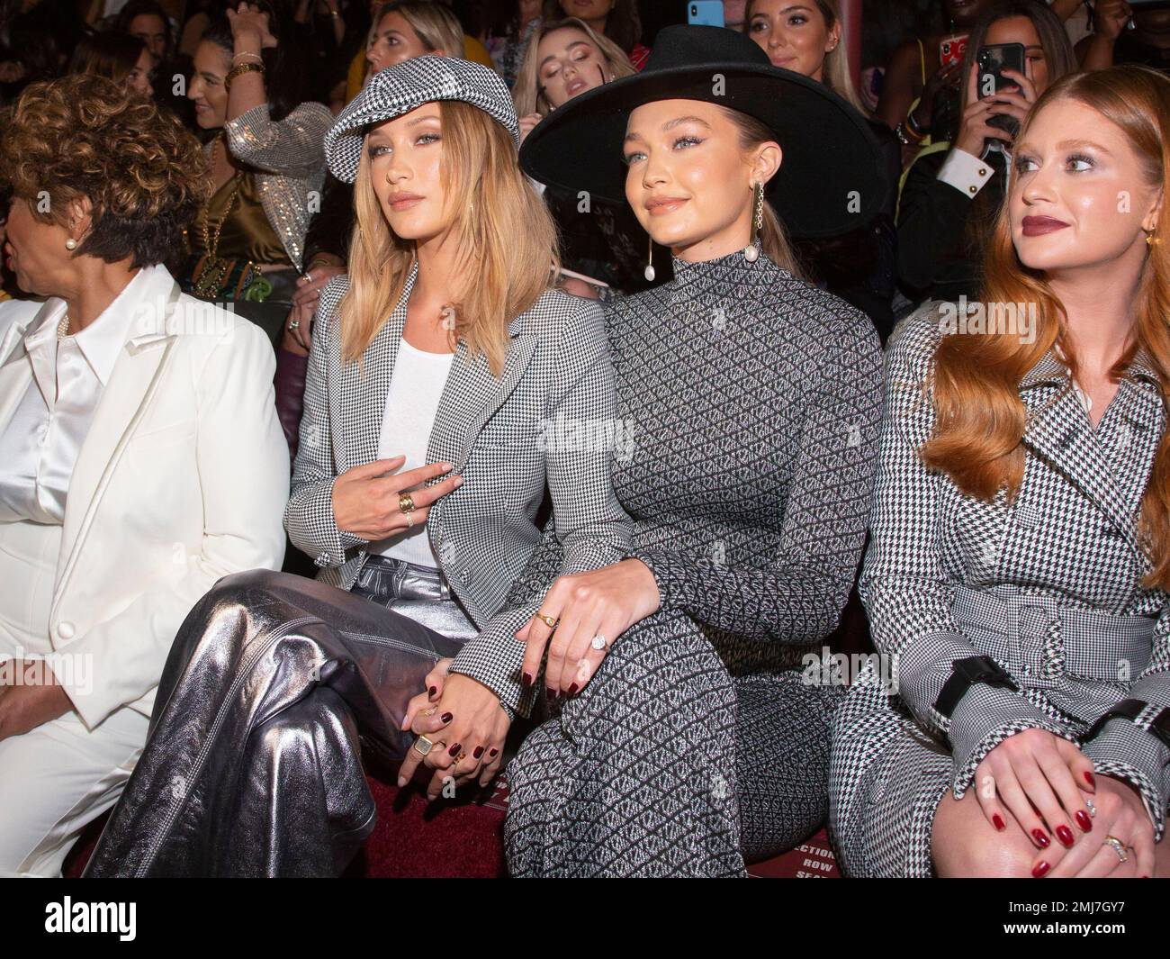 Fashion models Gigi Hadid, left, and Bella Hadid, right, attend the ...