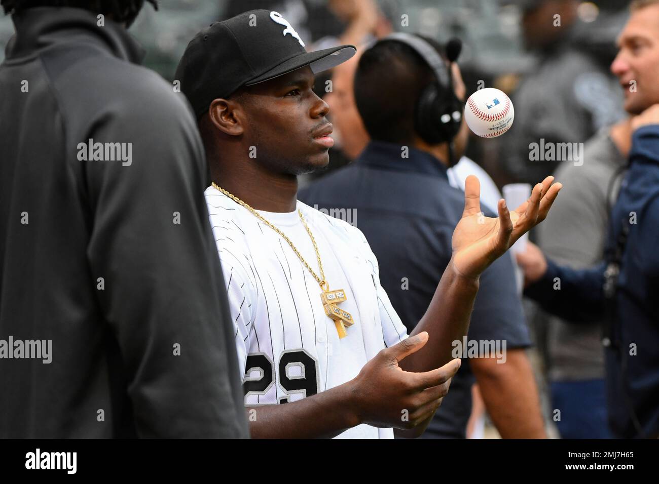 Khalil Mack, a player for the Chicago Bears, warms up before he threw ...