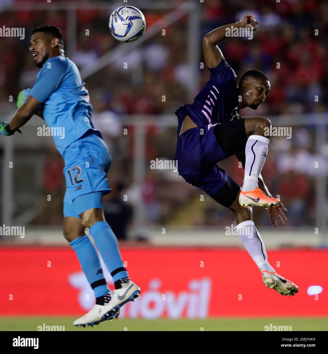 Bermuda's Justin Donawa, right, and Panama's goalkeeper Jose Calderon ...