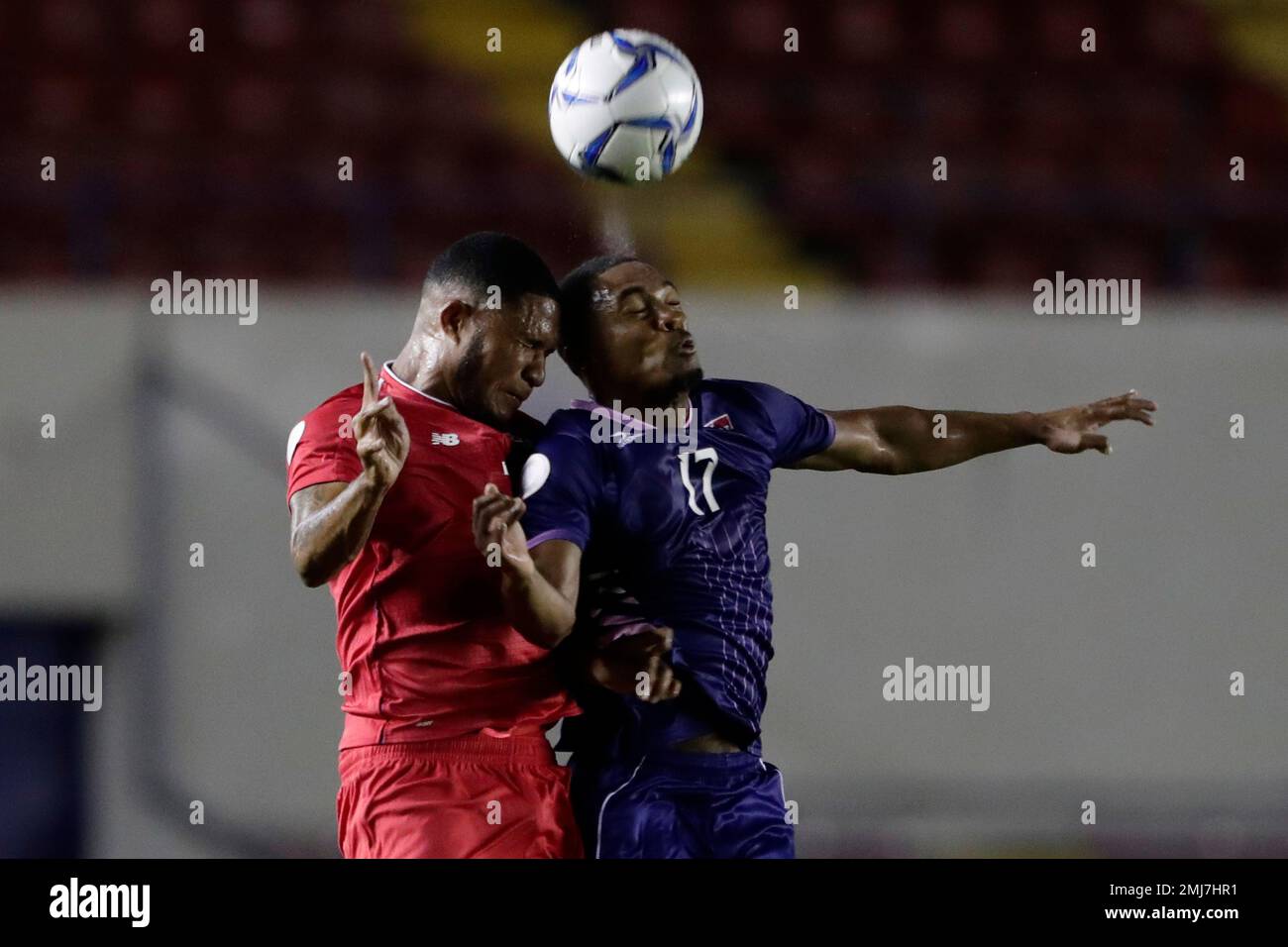Panama's Erick Davis, left, and Bermuda's Justin Donawa, jumps for a ...