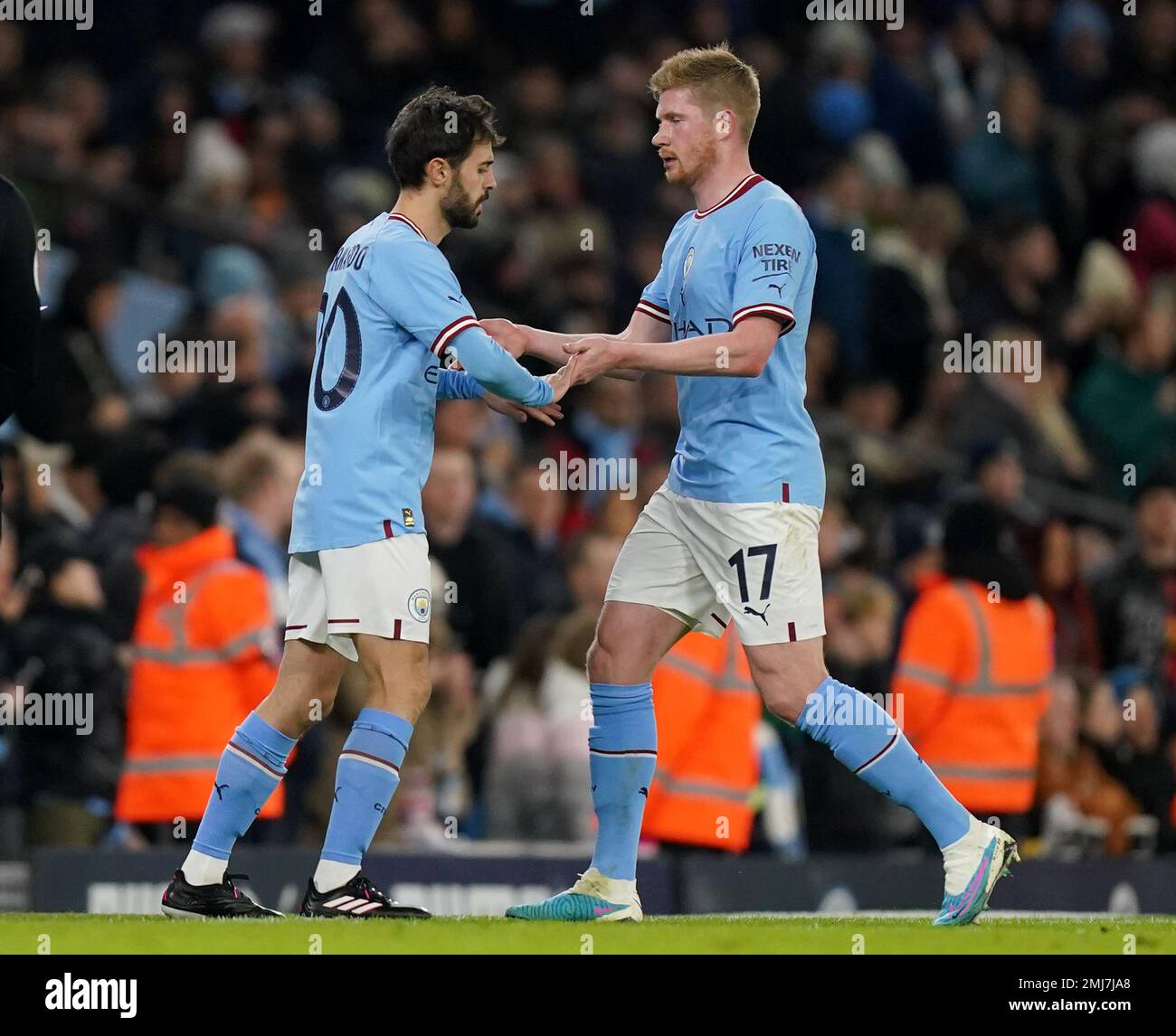 Manchester City's Kevin De Bruyne (right) is replaced by team-mate ...