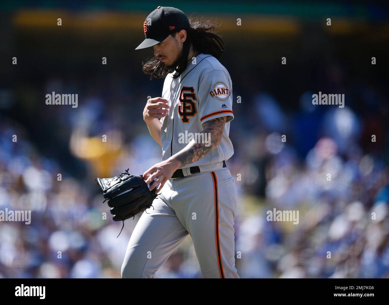 San Francisco Giants starting pitcher Dereck Rodriguez walks off the ...