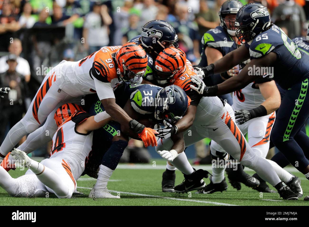 Seattle Seahawks running back Chris Carson (32) is tackled by ...