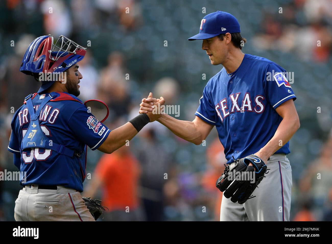 Texas Rangers relief pitcher Luke Farrell, right, celebrates with ...