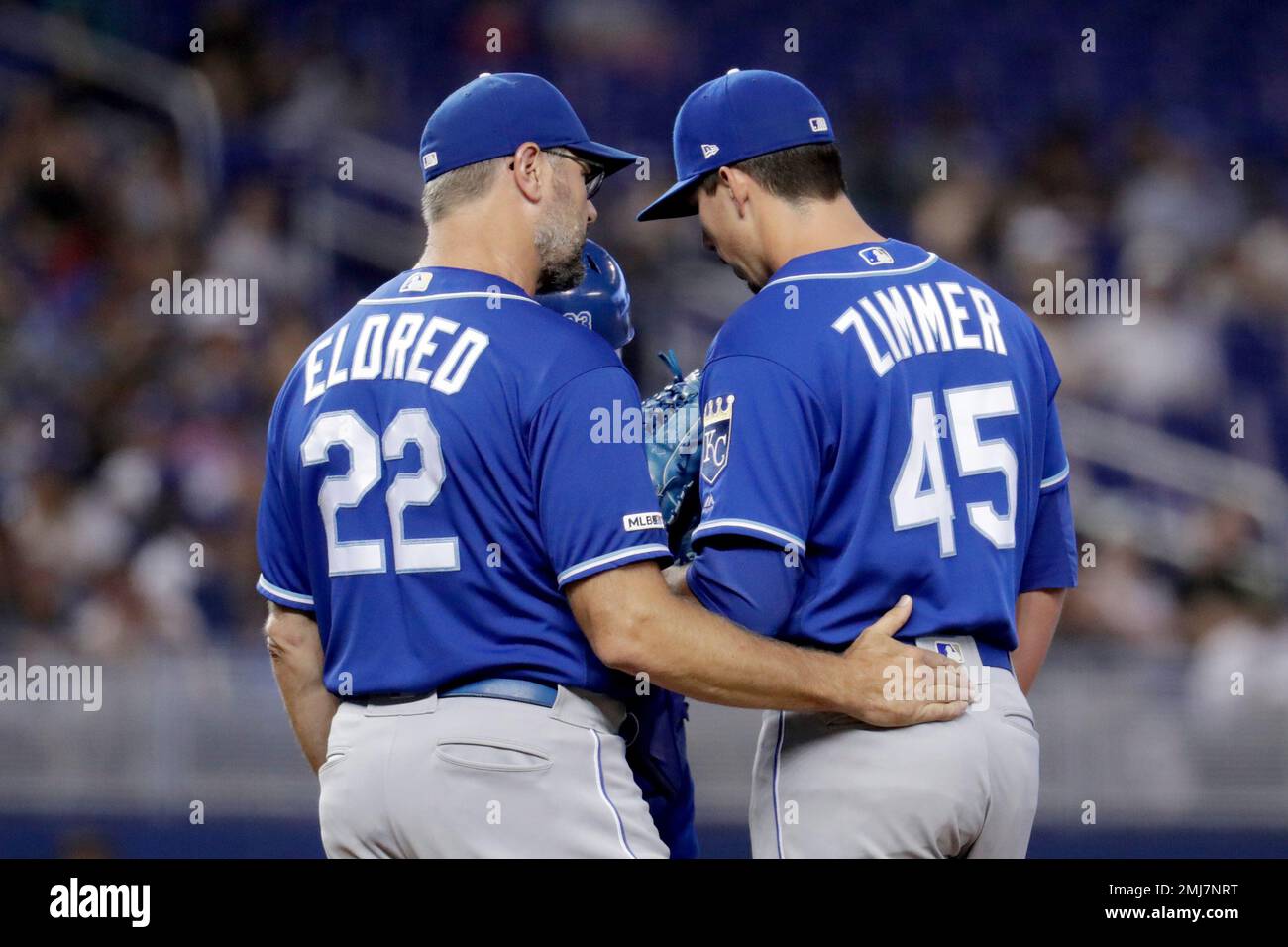 Kansas City Royals pitching coach Cal Eldred (22) talks with relief ...