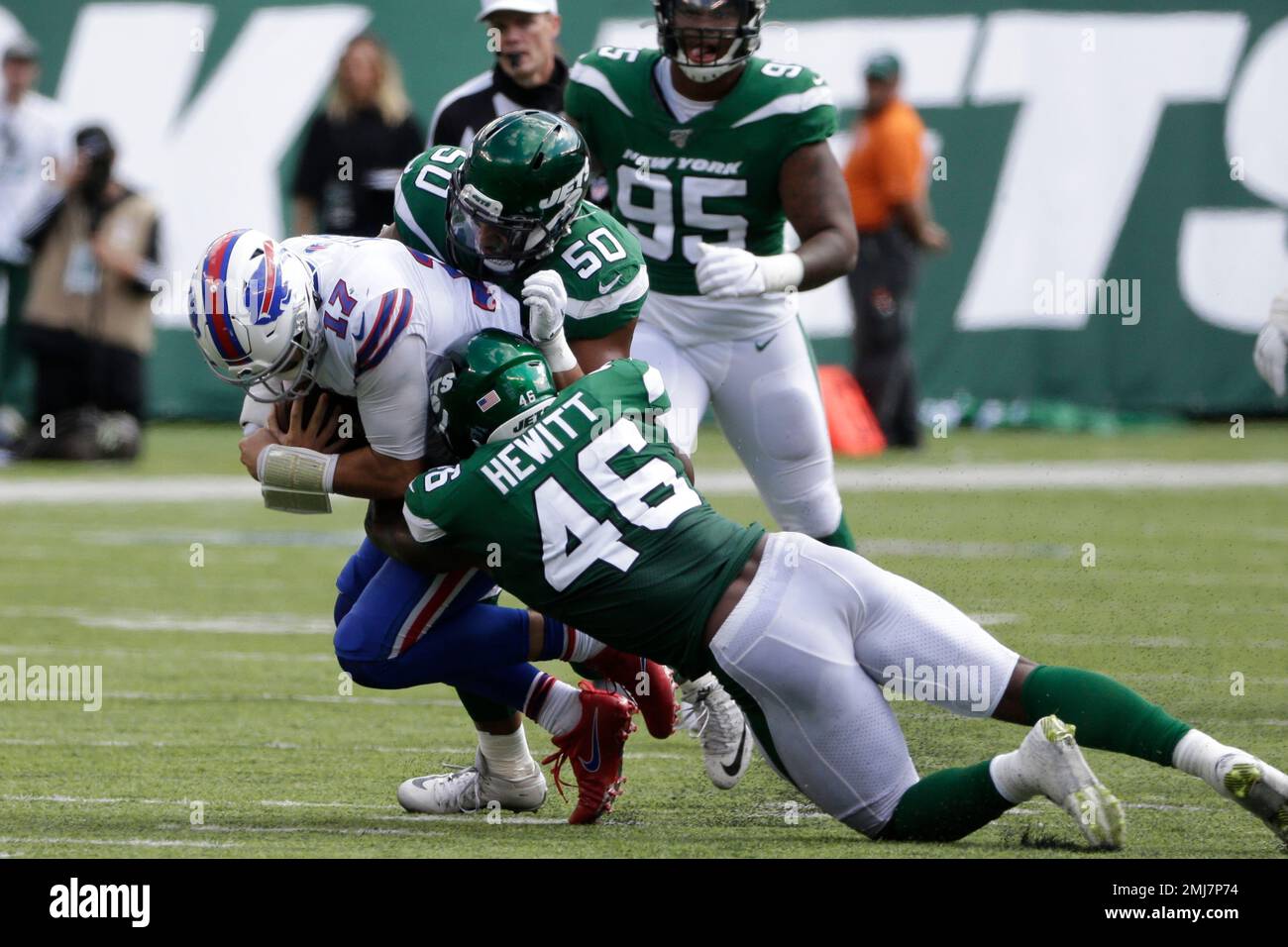 New York Jets' Neville Hewitt (46) and Frankie Luvu (50) tackle Buffalo ...
