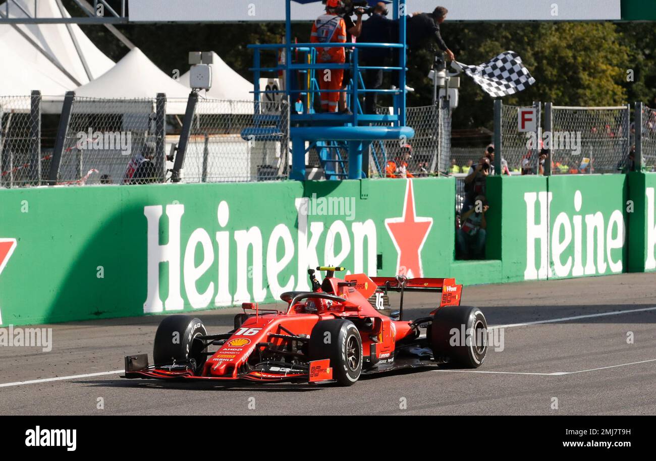 Ferrari driver Charles Leclerc of Monaco crosses the finish line to win ...