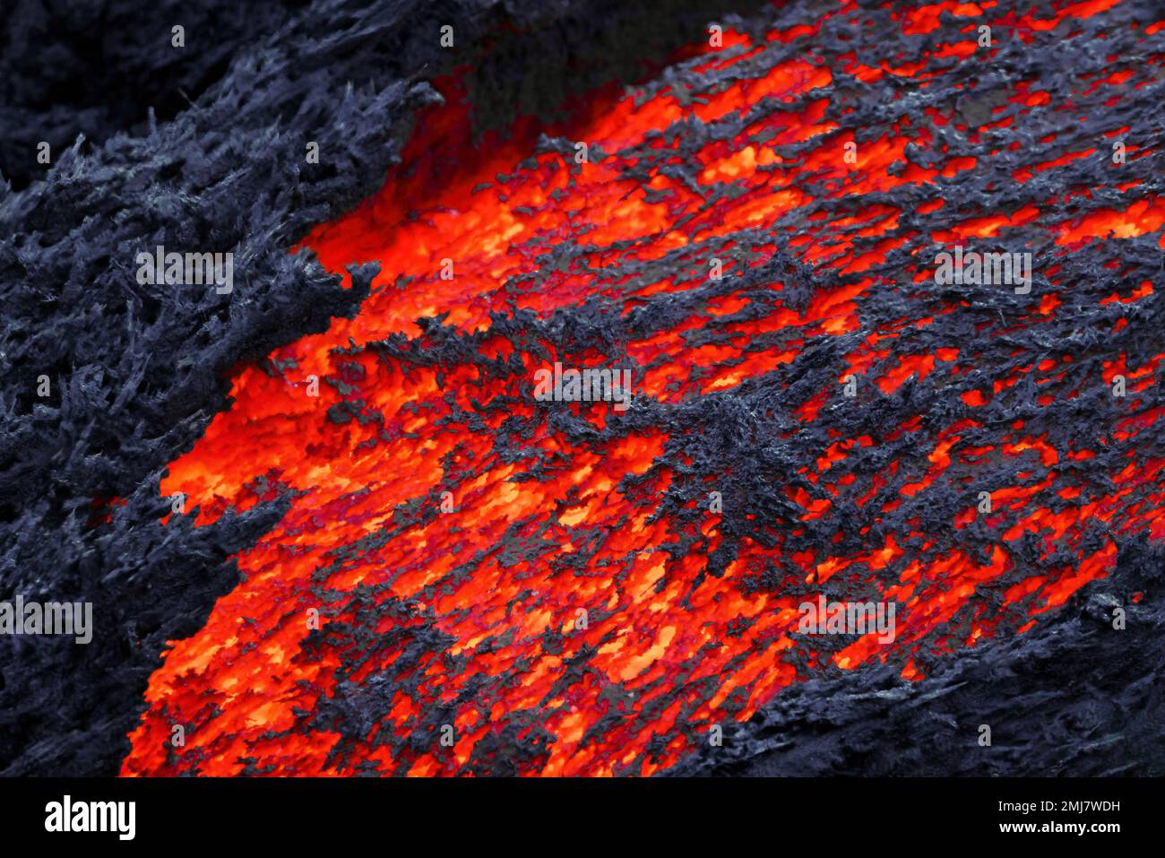 Lava flow in a detail view - red vivid molten lava Stock Photo - Alamy