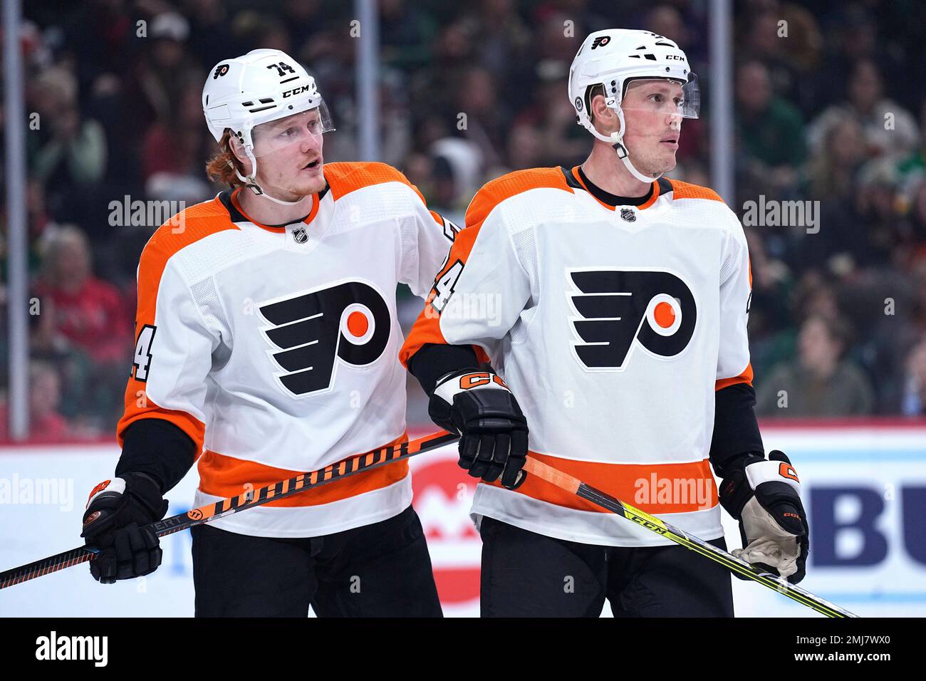 Philadelphia Flyers goaltender Carter Hart (79), left, and defenseman ...