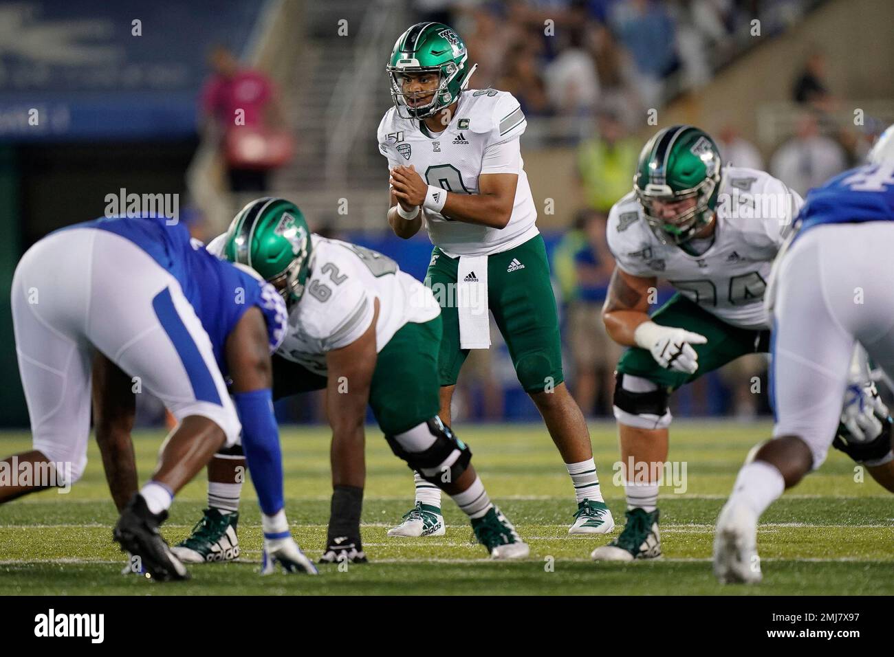 Eastern Michigan quarterback Mike Glass III (9) lines up at the line of ...